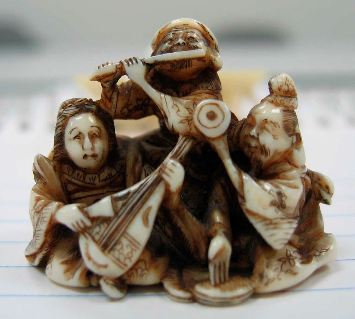 netsuke (three gods playing musical instruments)