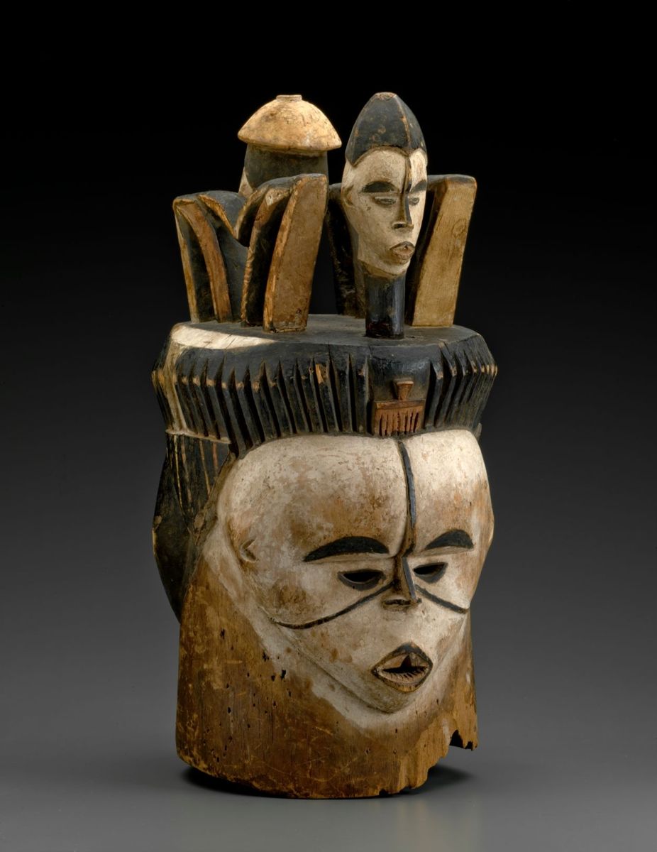 Janus-faced helmet mask with two human head finials